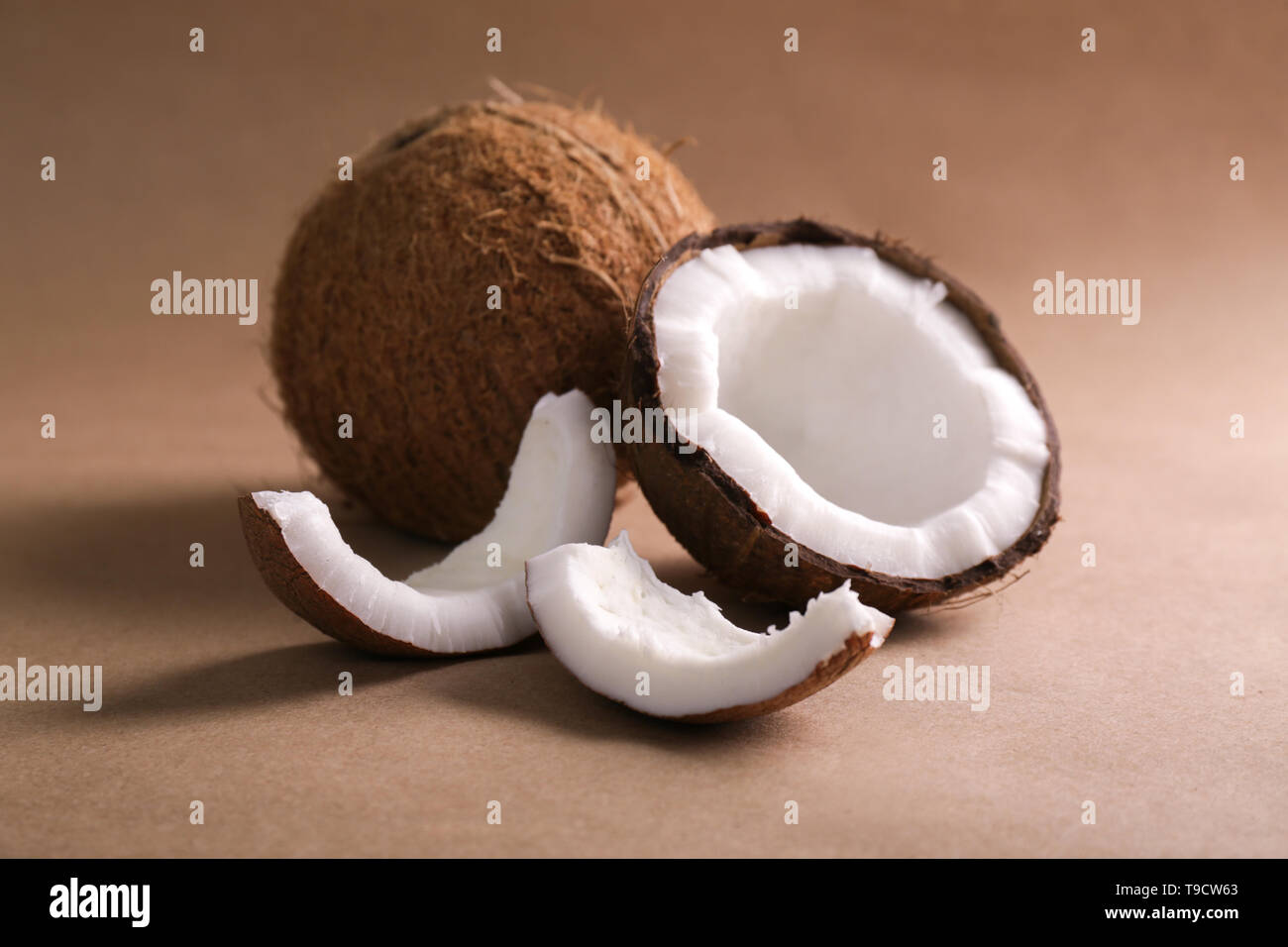 Ripe coconuts on color background Stock Photo - Alamy