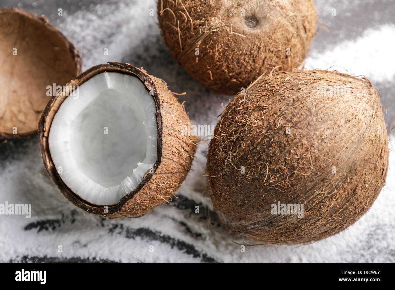 Ripe coconuts on grey background Stock Photo - Alamy