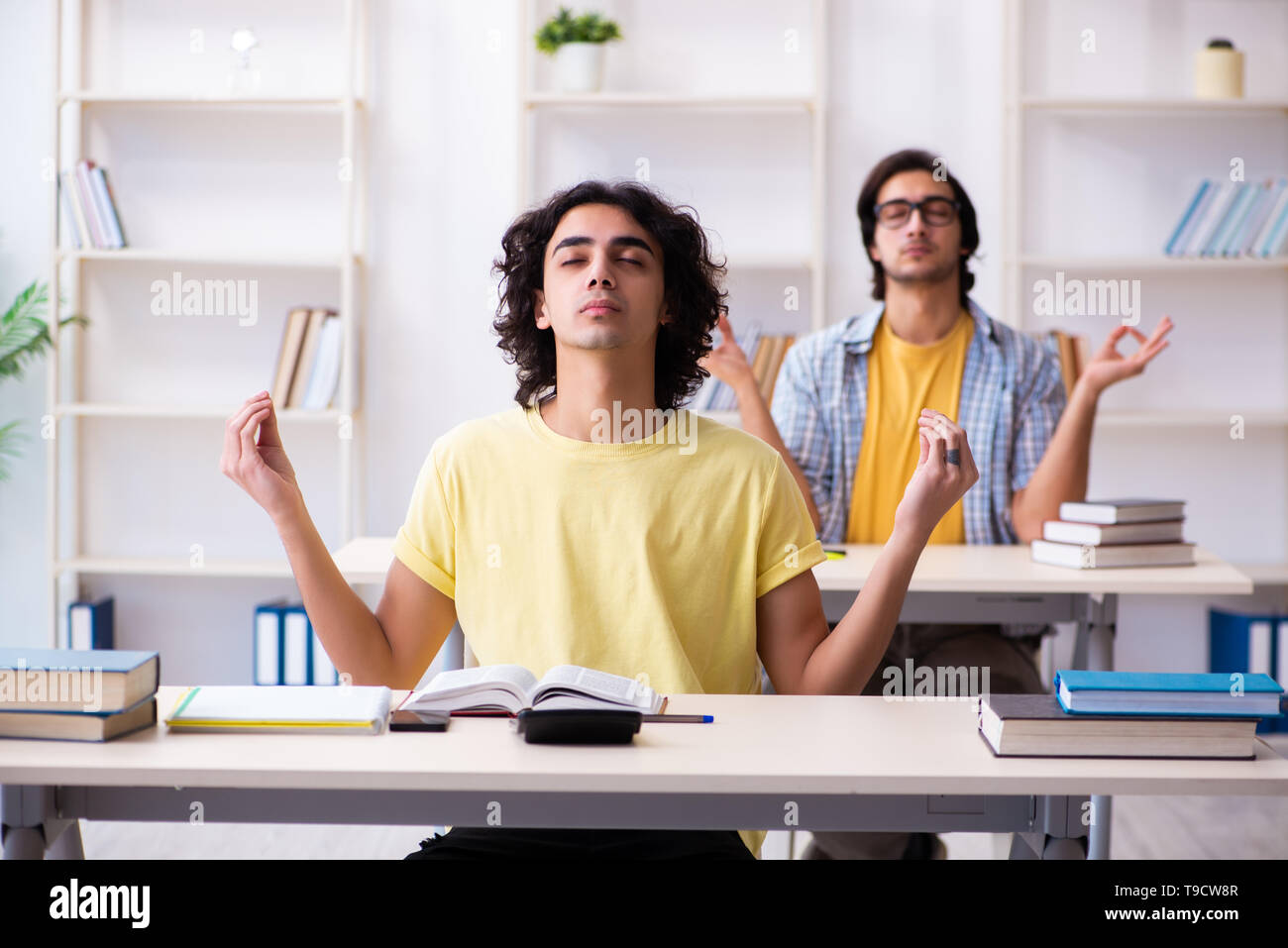 Two male students in the classroom Stock Photo - Alamy