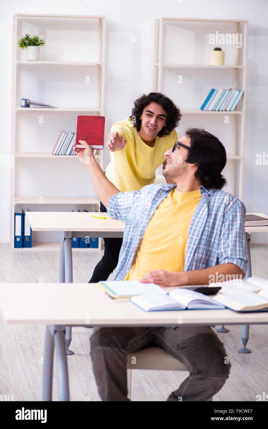 Two male students in the classroom Stock Photo - Alamy