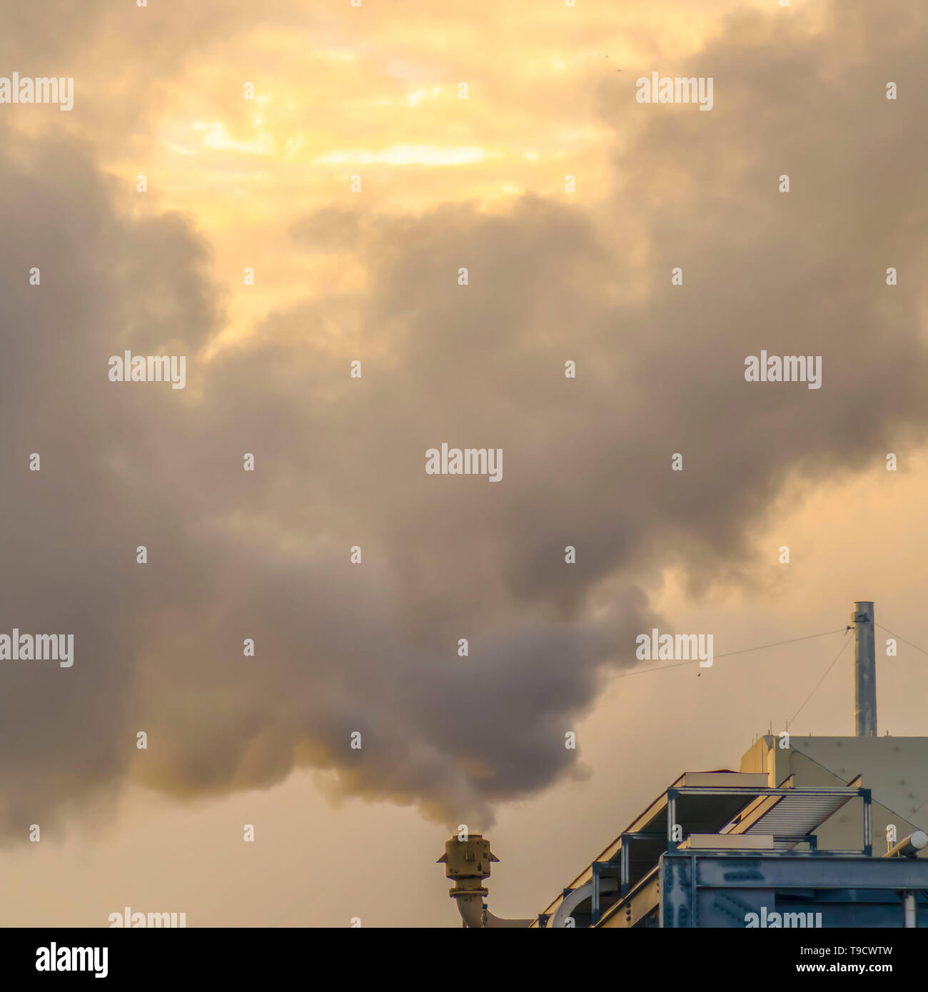 Square Smokestack of a Power Plant in Utah Valley releasing steam into ...