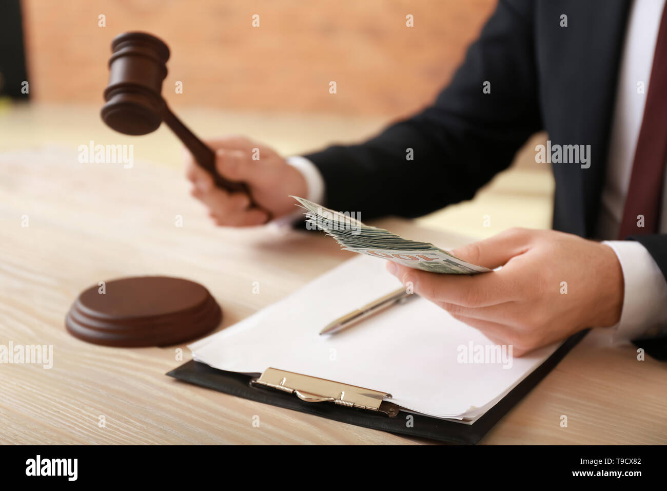 Judge with bribe at table, closeup. Corruption concept Stock Photo - Alamy