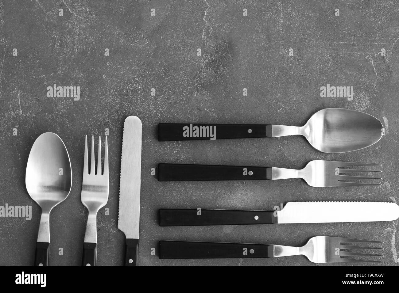 Set of cutlery on grey background, flat lay Stock Photo - Alamy