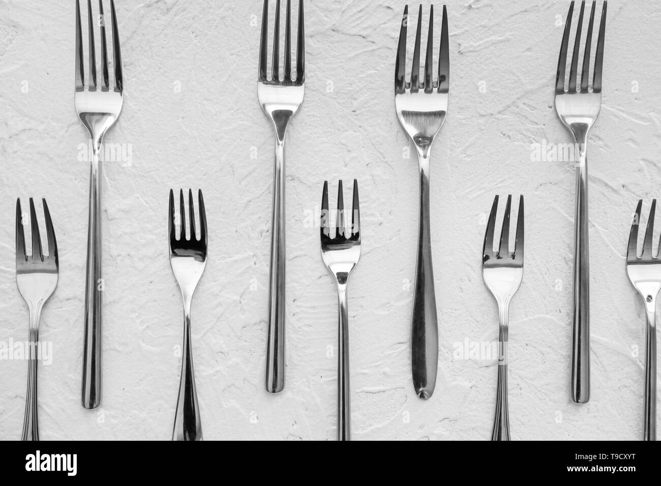 Many forks on white textured background, flat lay Stock Photo - Alamy