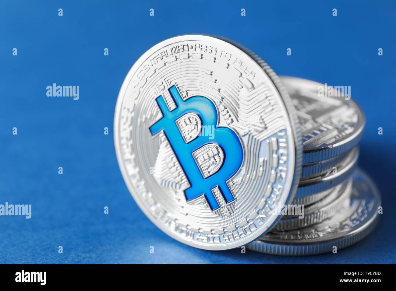 Bitcoins on color background, closeup Stock Photo - Alamy