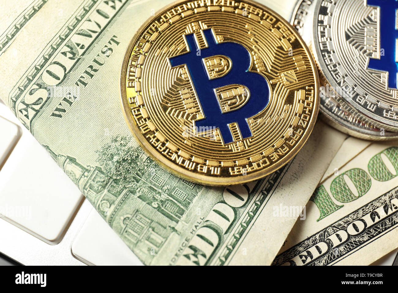 Bitcoins and dollar banknotes on PC keyboard, closeup Stock Photo - Alamy