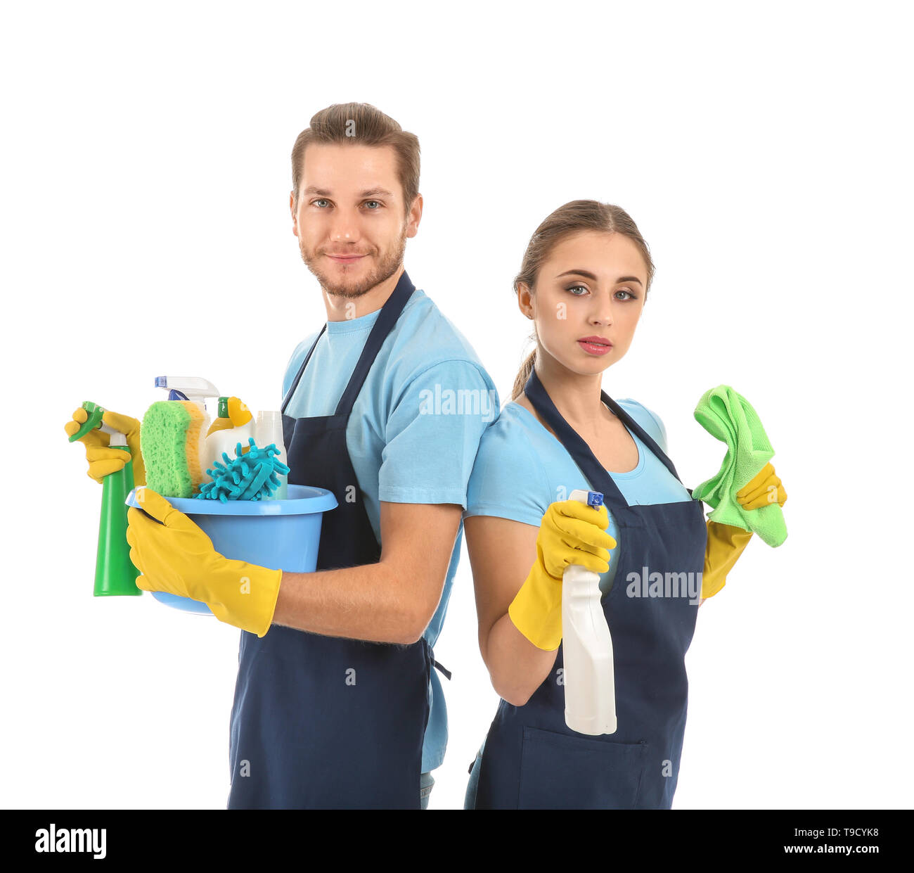 Man and woman with cleaning supplies on white background Stock Photo ...