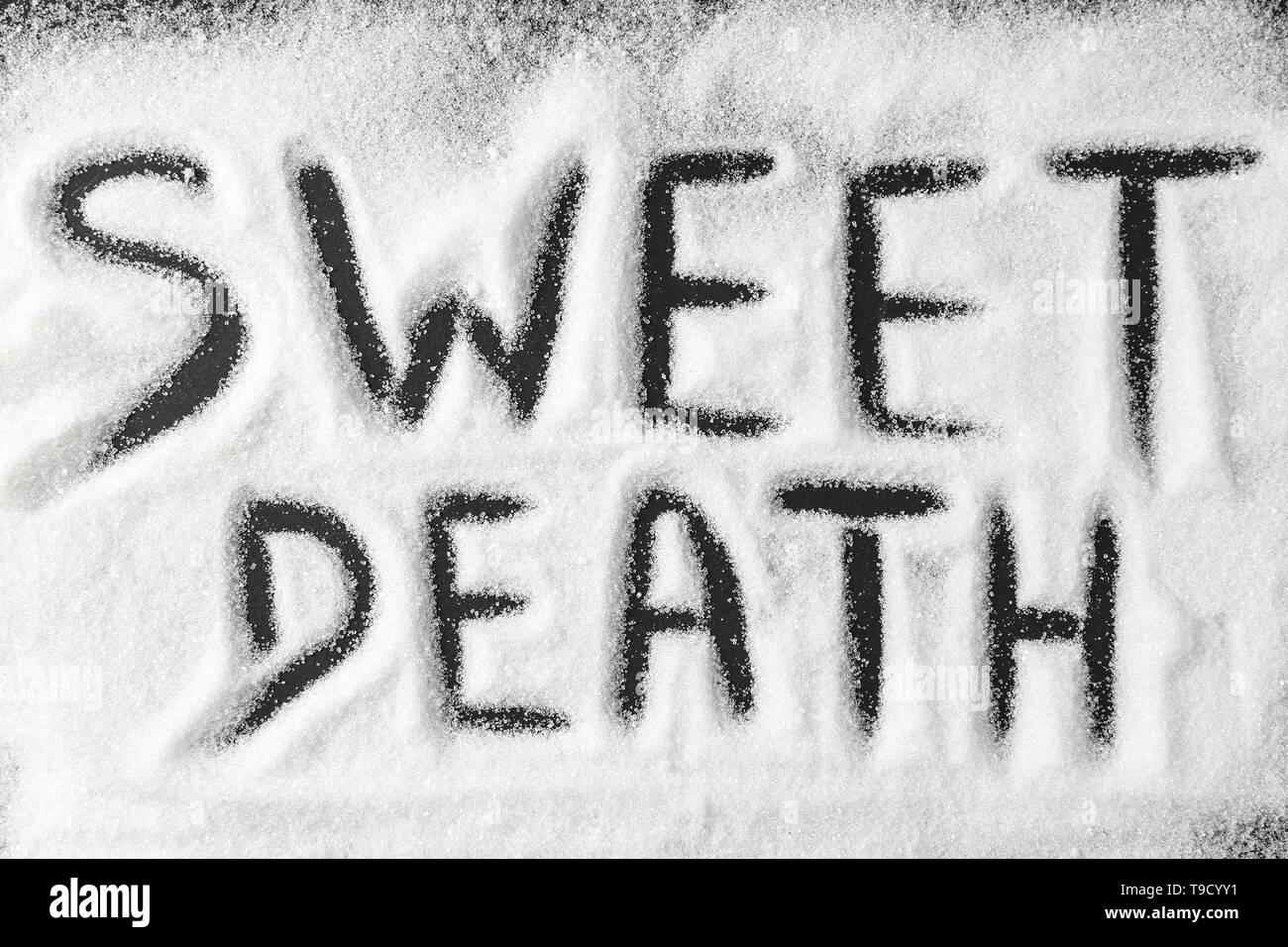 Text SWEET DEATH written on sugar Stock Photo - Alamy