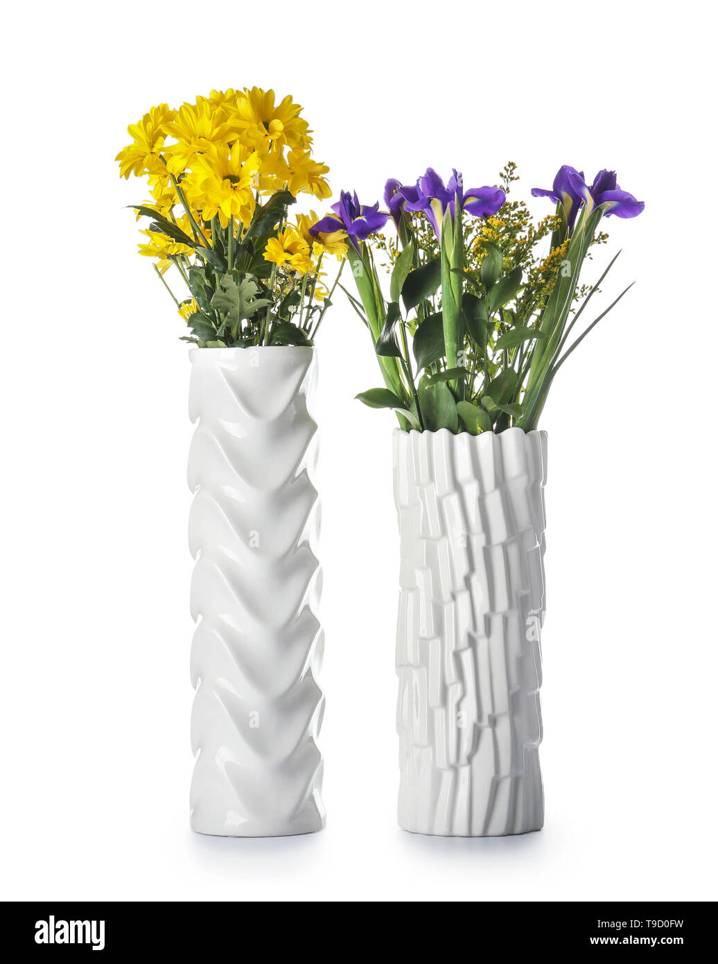 Beautiful flowers in ceramic vases on white background Stock Photo - Alamy