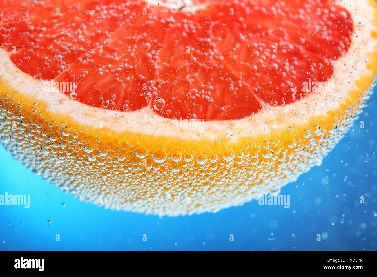 Ripe grapefruit half in water, closeup Stock Photo - Alamy