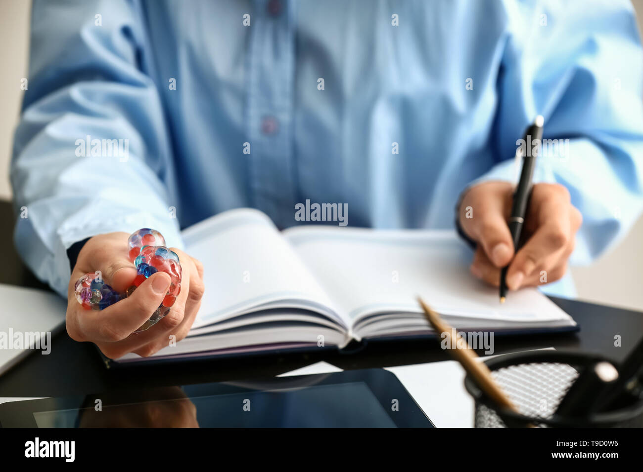 Squeezing stress ball hi-res stock photography and images - Alamy