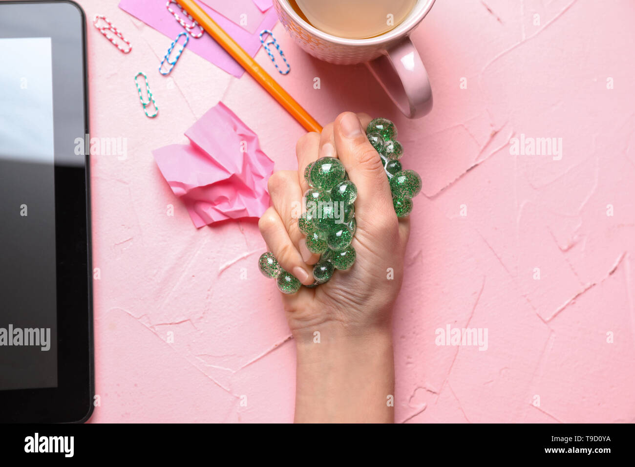 Hand squeezing anti stress ball hi-res stock photography and images - Alamy