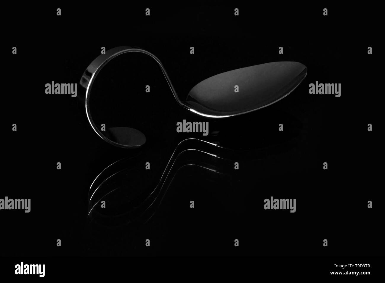 Curved spoon black Black and White Stock Photos & Images - Alamy