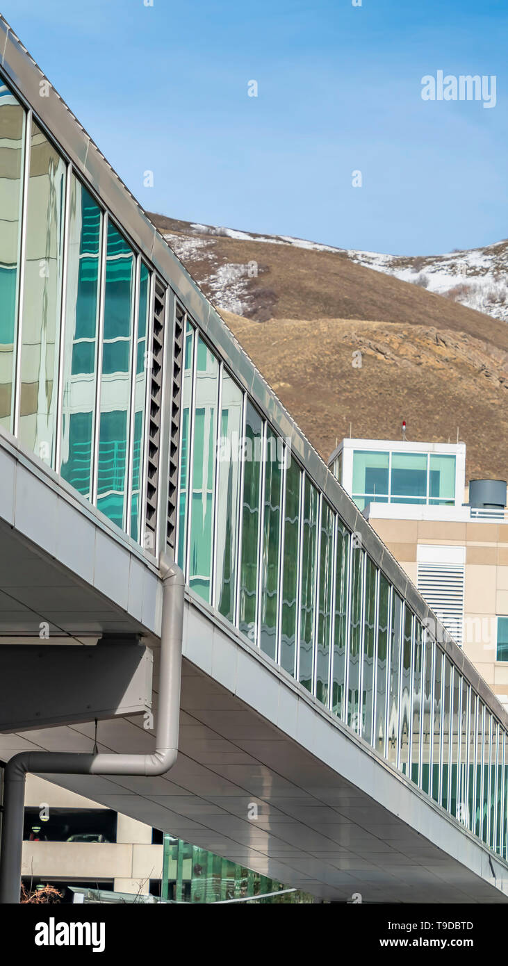 Clear Vertical Sunny day view of a modern building exterior with a ...