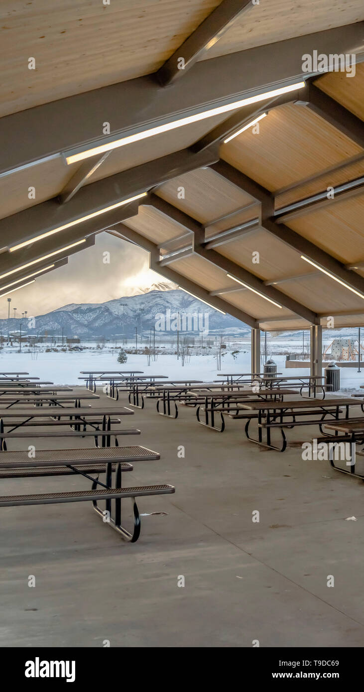 Clear Vertical Covered picnic area and playground at a park blanketed ...