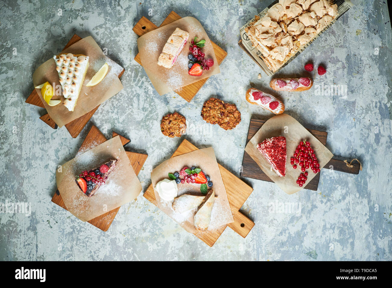 Assorted sweet desserts: cake, churos, meringue roll, ice cream ...
