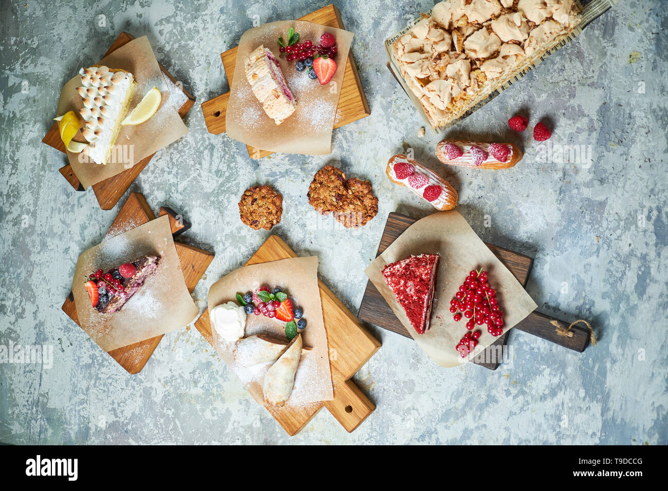 Assorted sweet desserts: cake, churos, meringue roll, ice cream ...