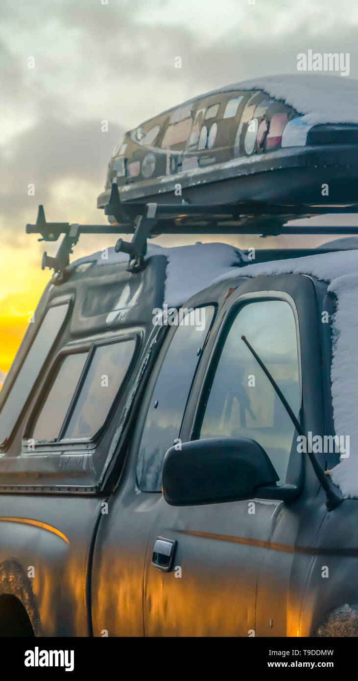 Clear Vertical Black vehicle with a roof rack and rooftop cargo carrier ...