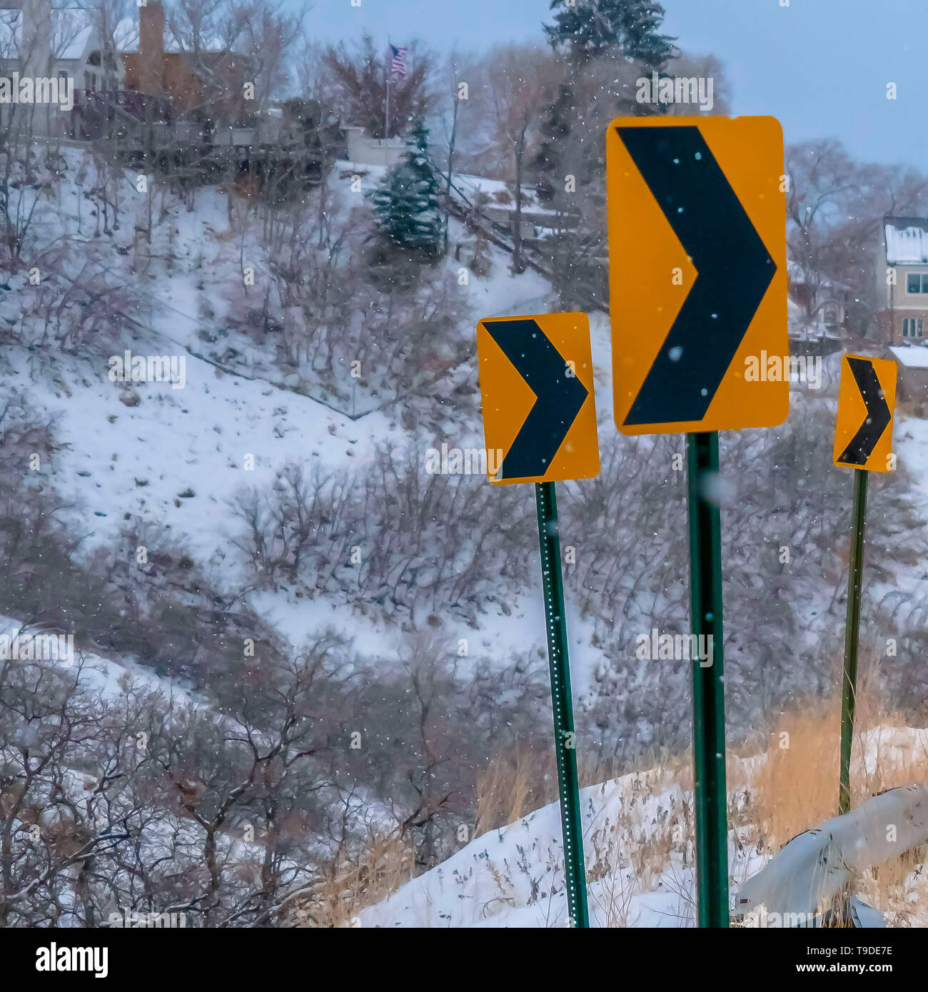 Square Directional road signs against snowy mountain day Stock Photo ...