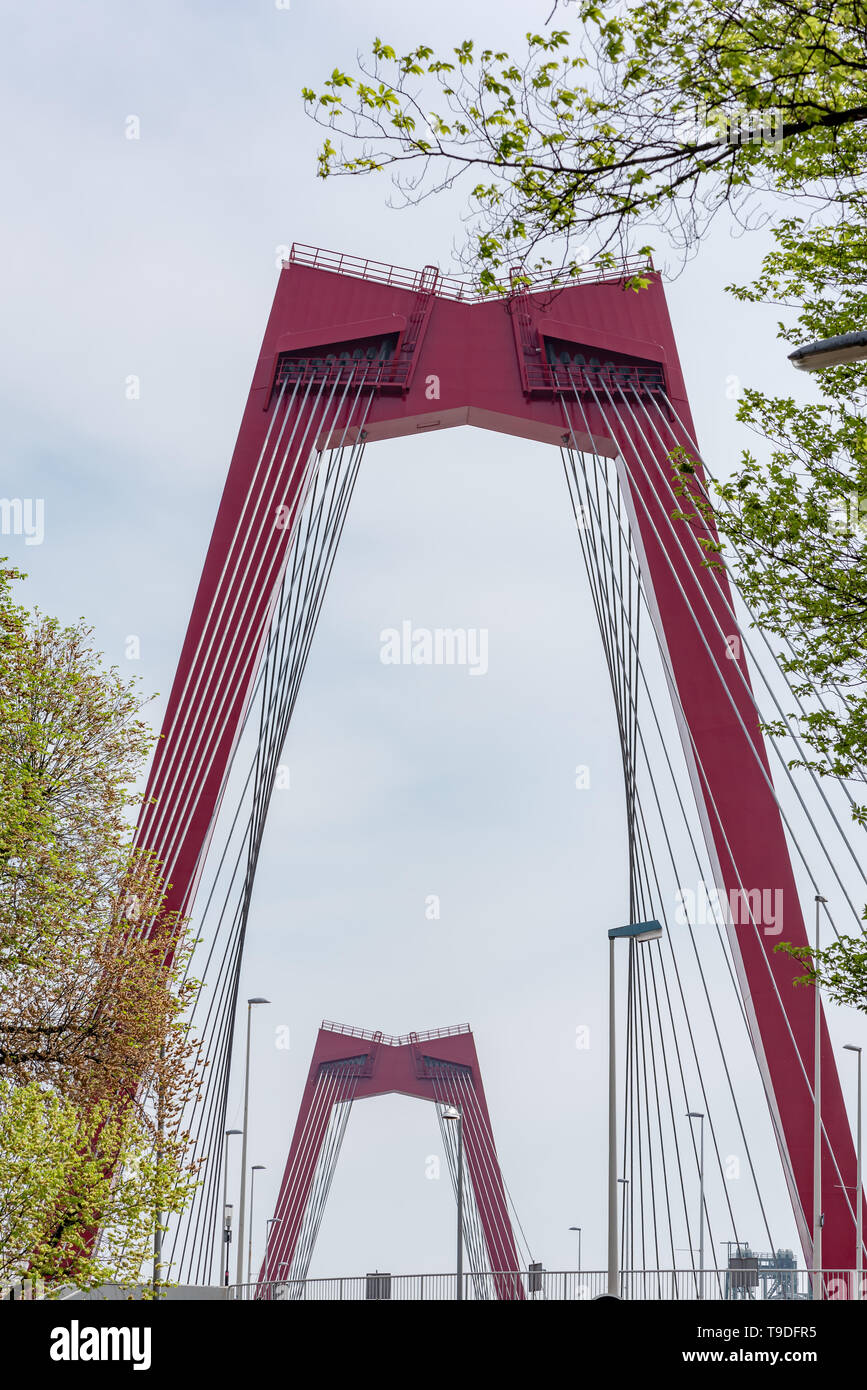 Willemsbrug bridge red cable bridge against sky, Rotterdam, Netherlands ...