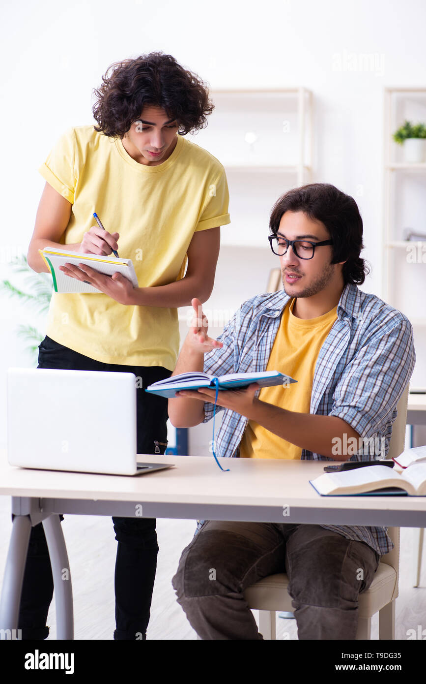 Two male students in the classroom Stock Photo - Alamy