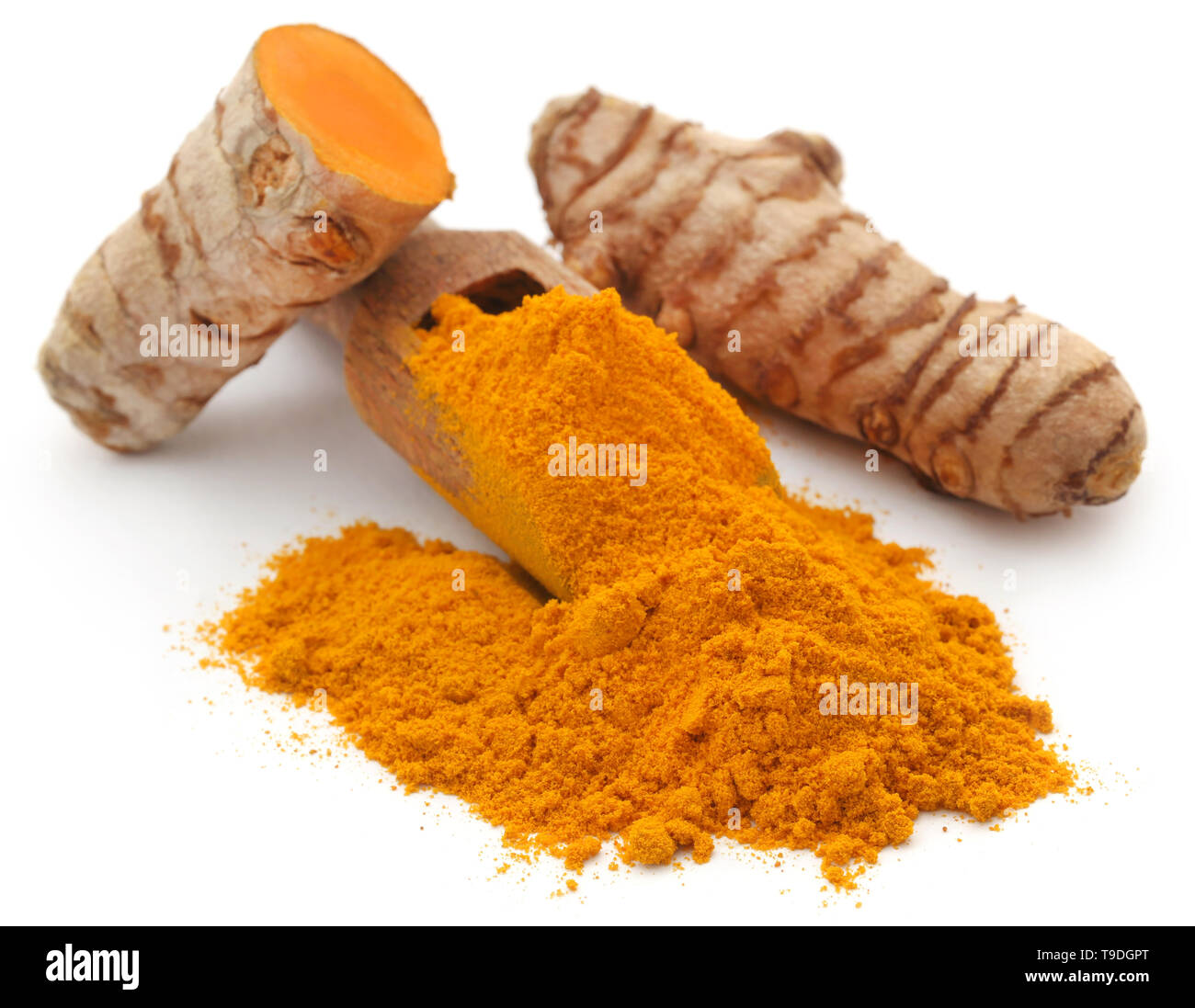 Raw turmeric with powder over white background Stock Photo - Alamy