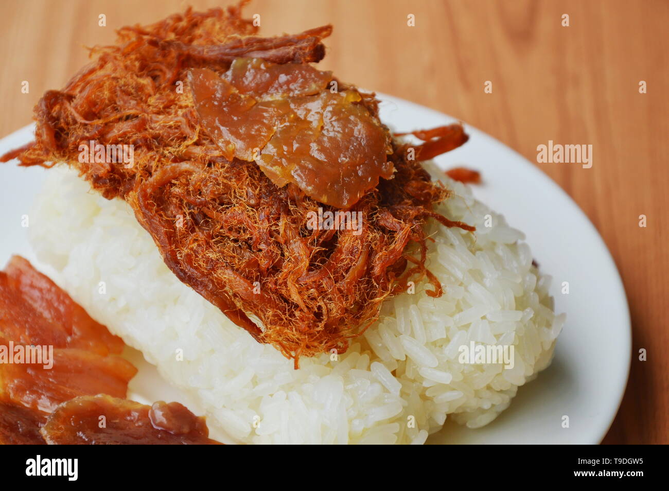 crispy shredded pork topping on sticky rice Stock Photo - Alamy
