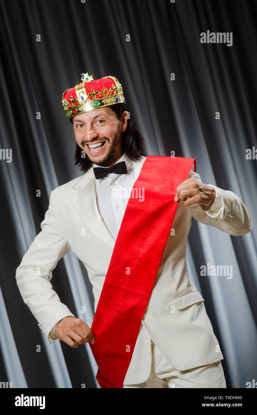 Funny king wearing crown in coronation concept Stock Photo - Alamy