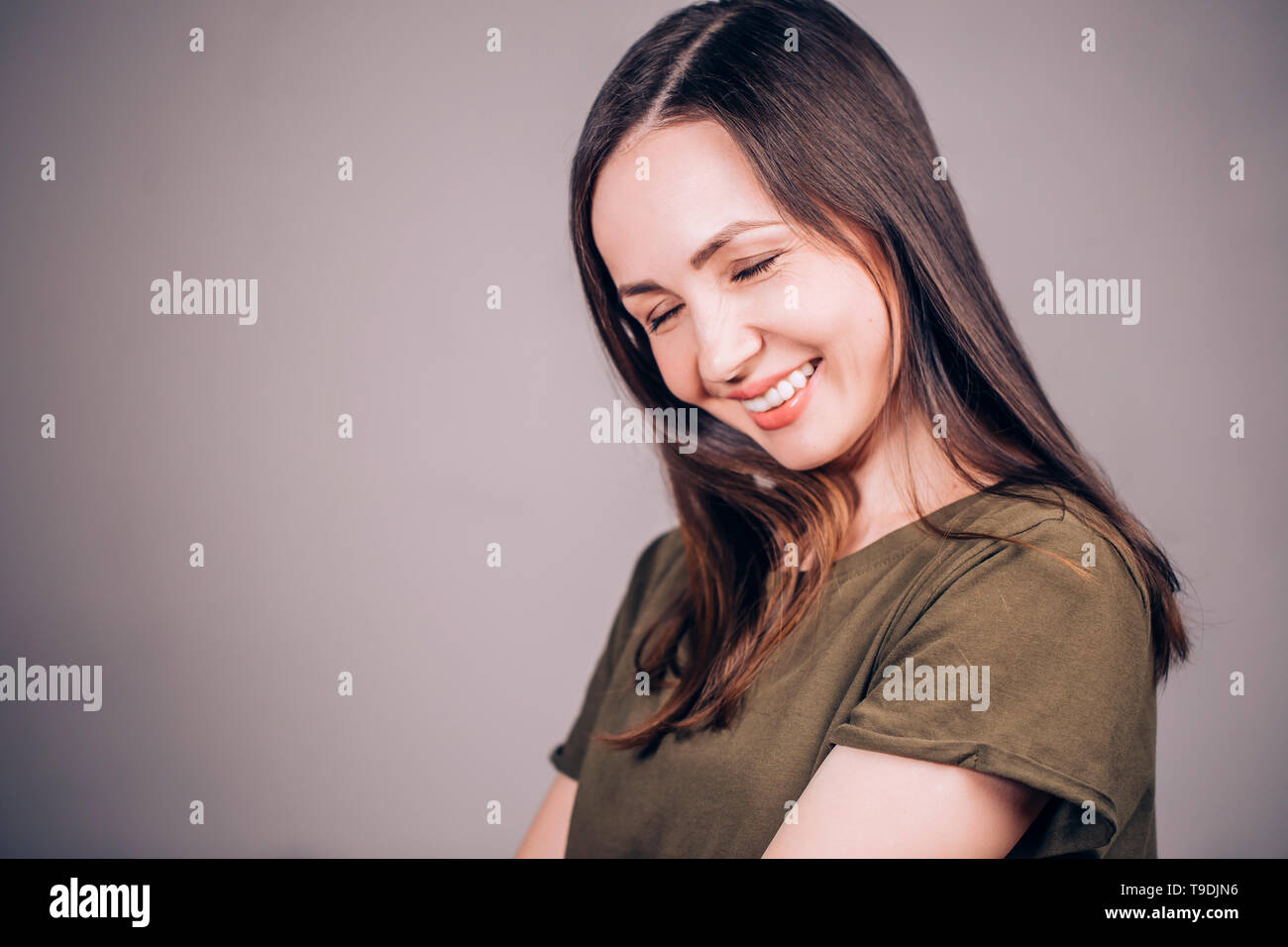 A very happy woman laughs with her eyes closed. Happiness, laughter ...