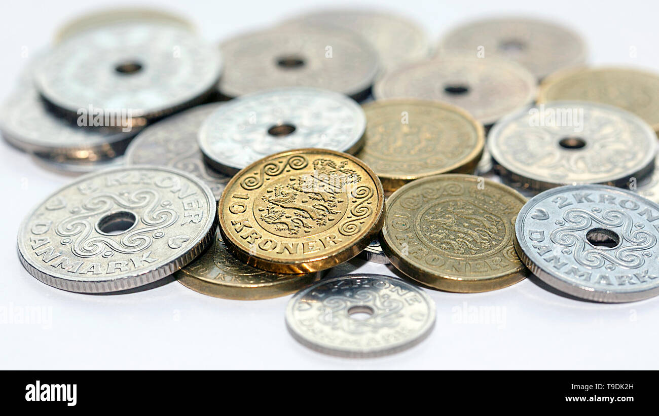 Pile of mixed Danish coins with selective focus. The krone is the ...