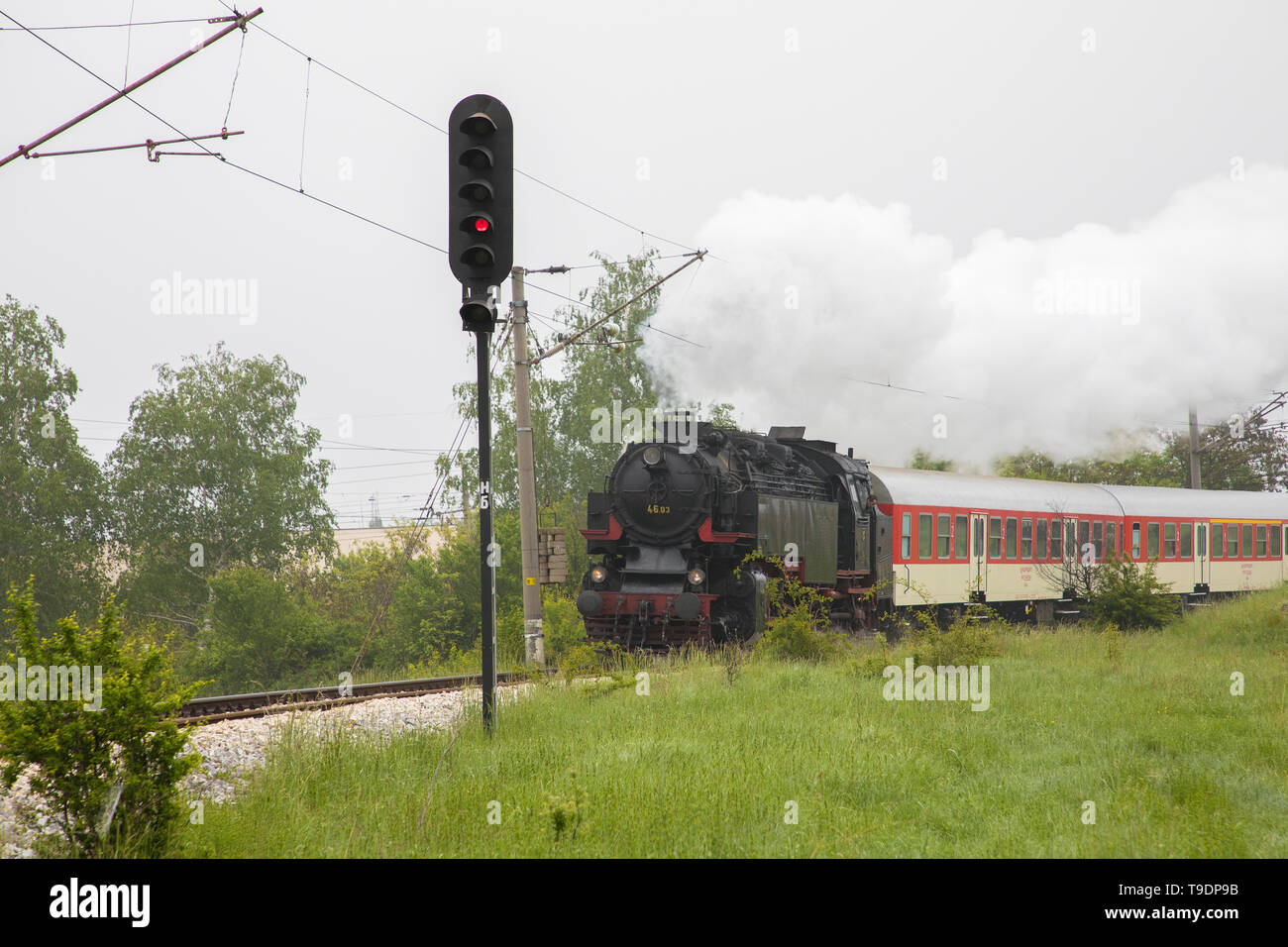 Vintage steam engine locomotive speeding on railroad tracks curve and ...