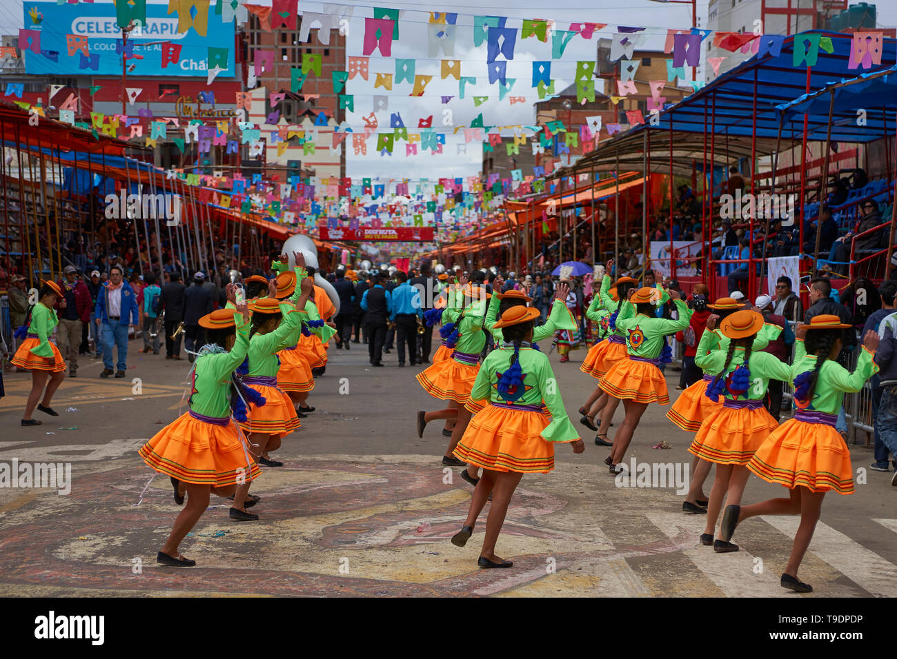 Dancers in colourful costumes parading through the mining city of Oruro ...