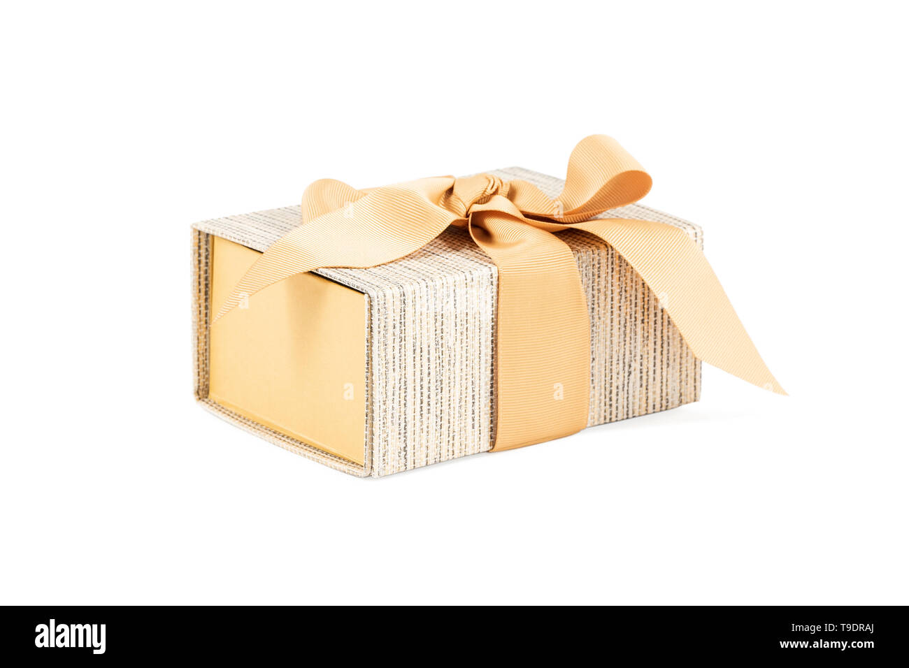 gift box of gold color with bow on top isolated on white background ...