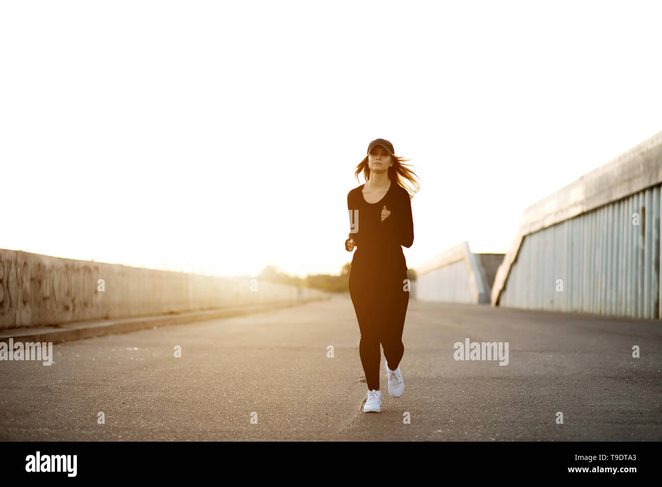 Beautiful woman running at sunset. Sports, health, youth concept Stock ...