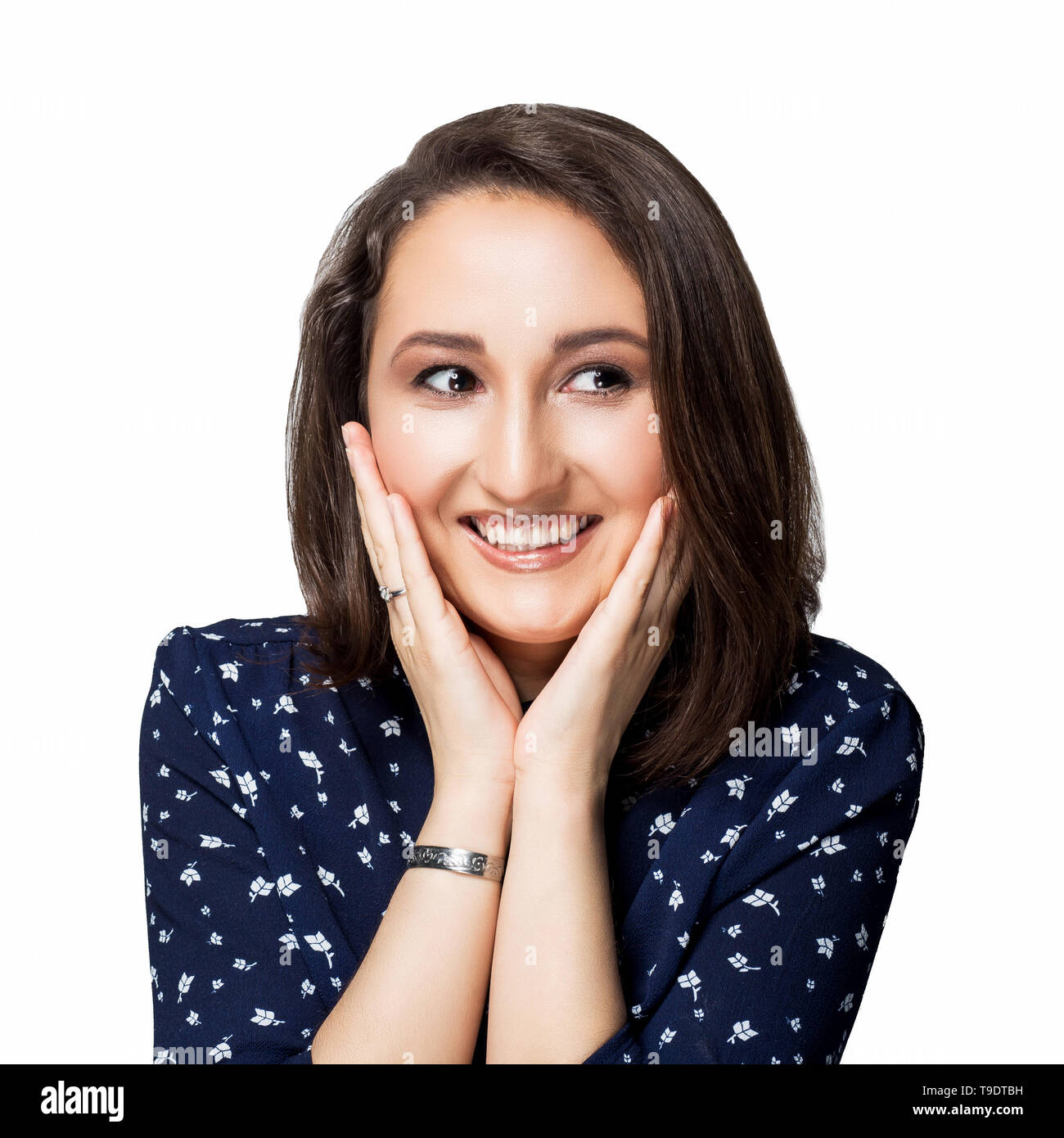 Woman holds cheeks by hand. Isolated on white background. Expressive ...