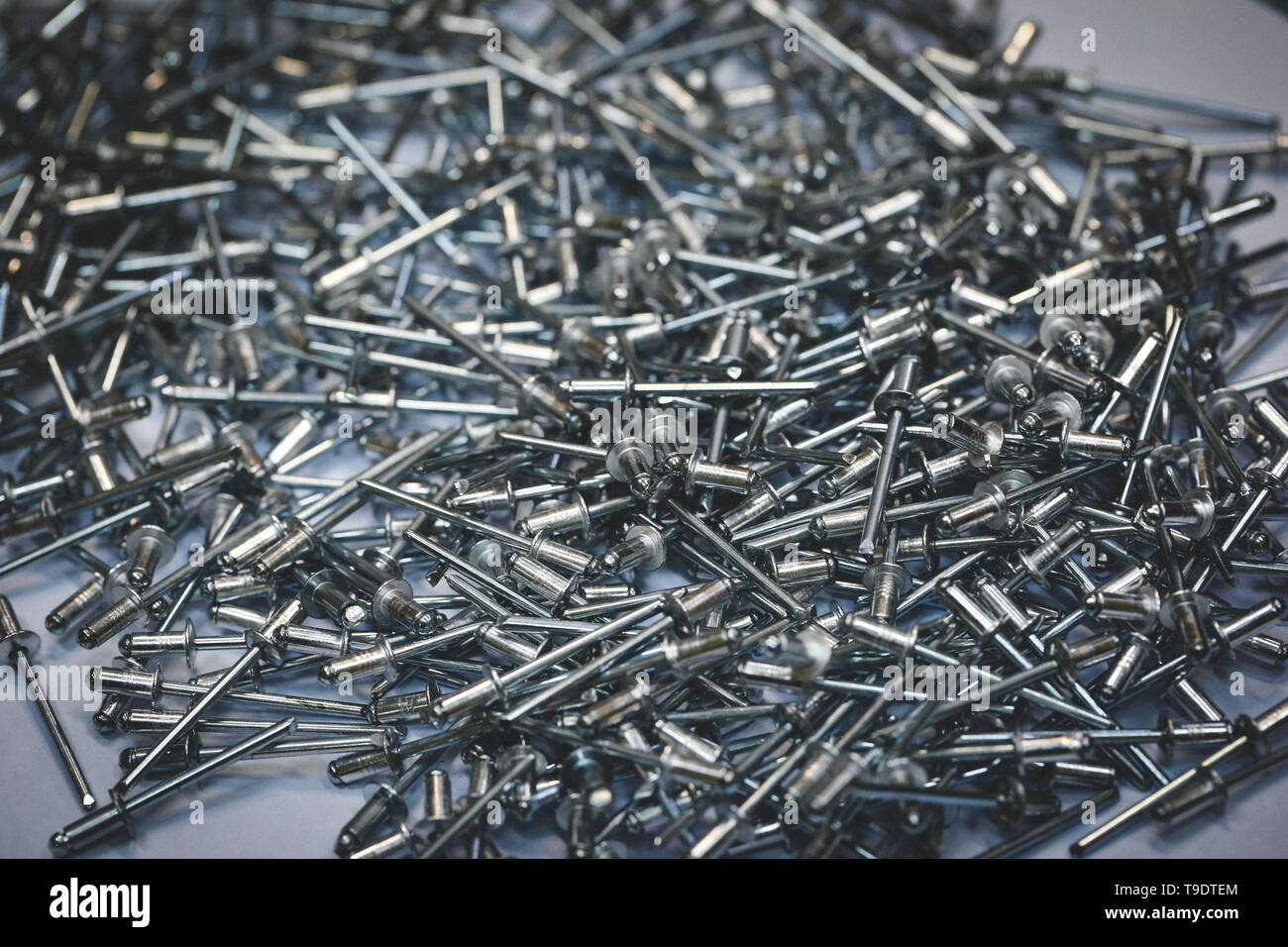 pile of rivets isolated on white background Stock Photo - Alamy