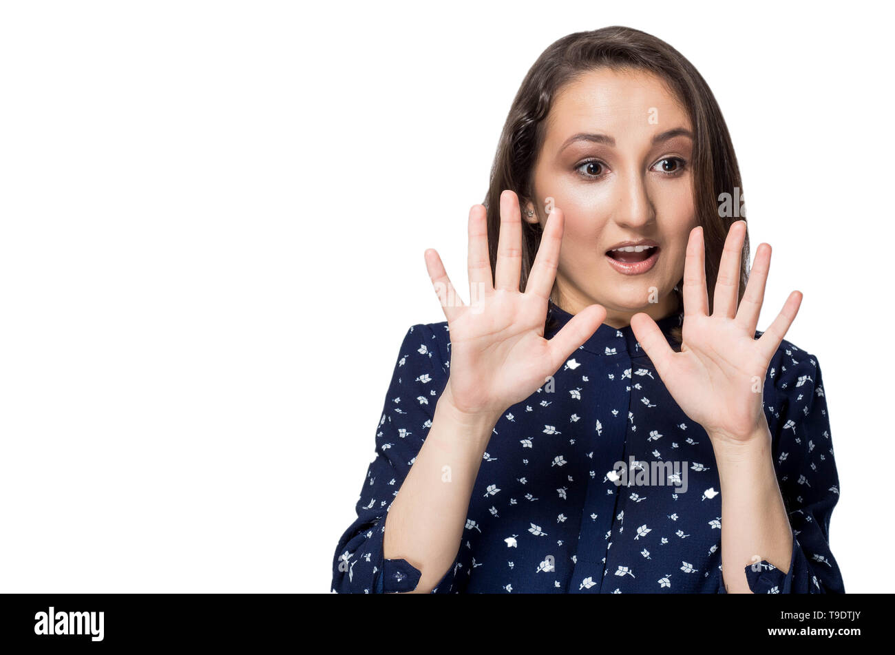 Young annoyed woman with bad attitude making stop gesture with palm ...