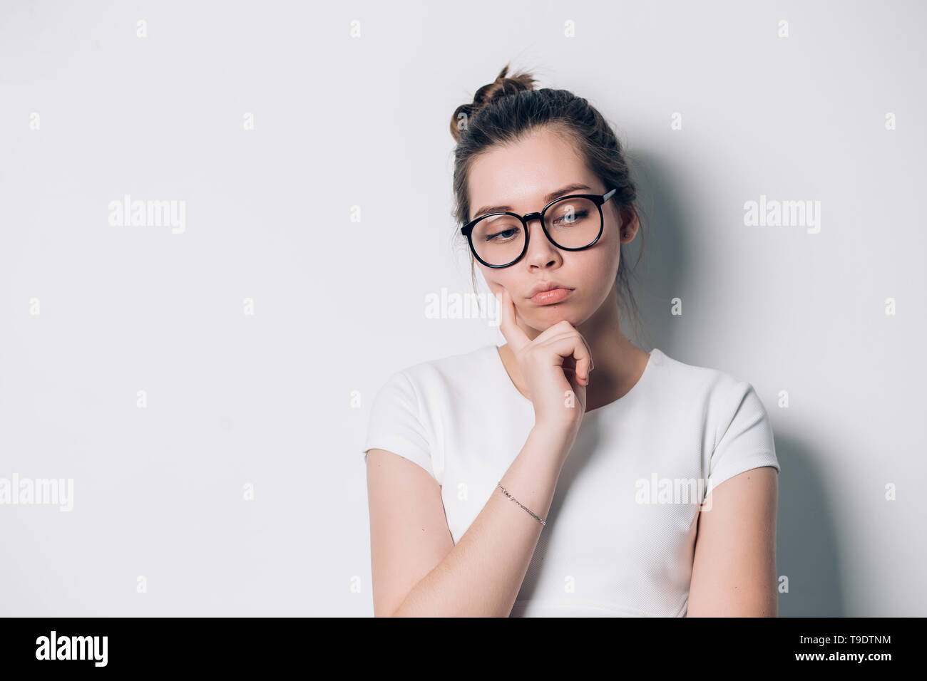 young beautiful sad woman serious and concerned looking worried and ...