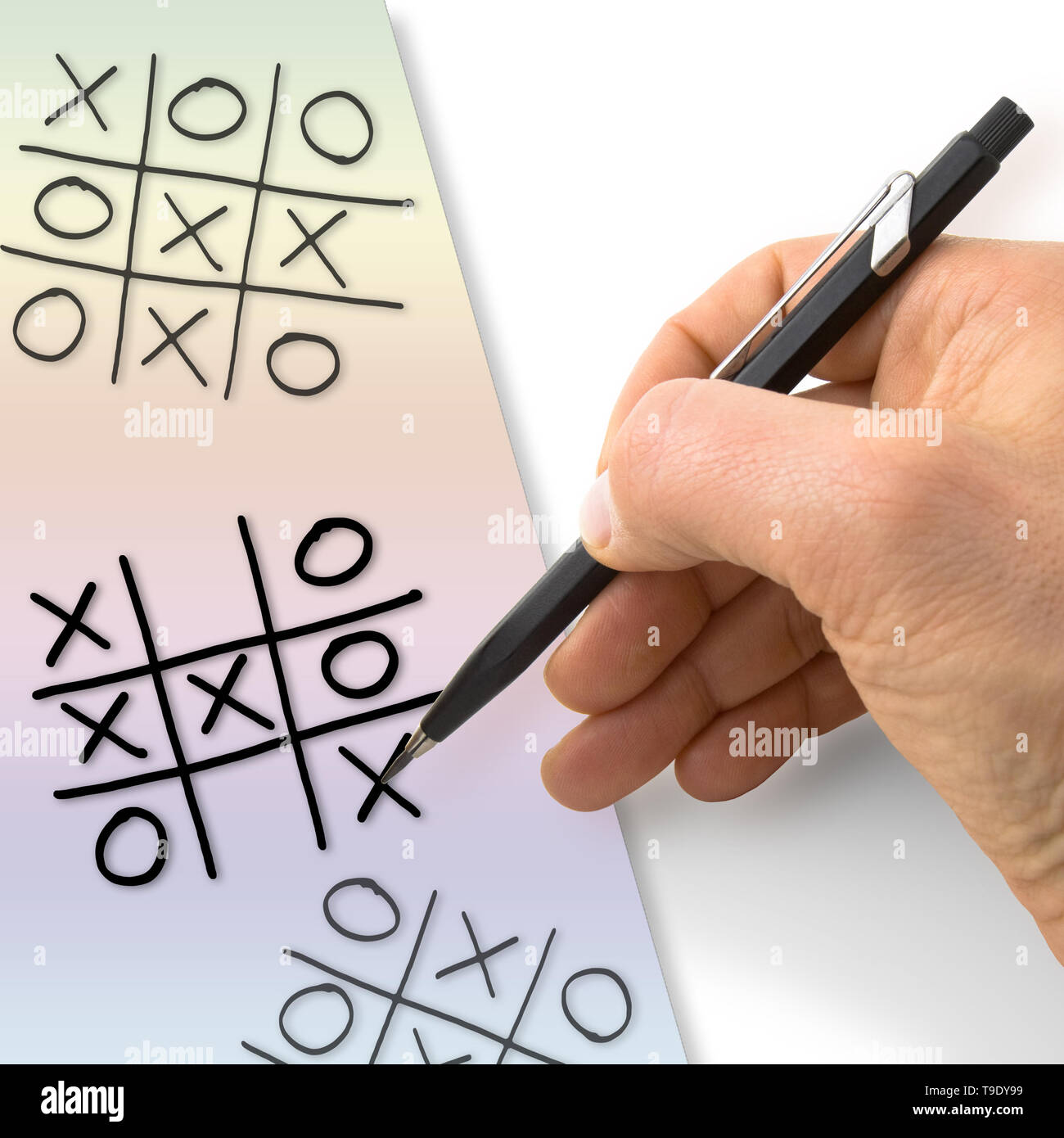 Hand draws the tris game on colored sheet - concept image Stock Photo ...
