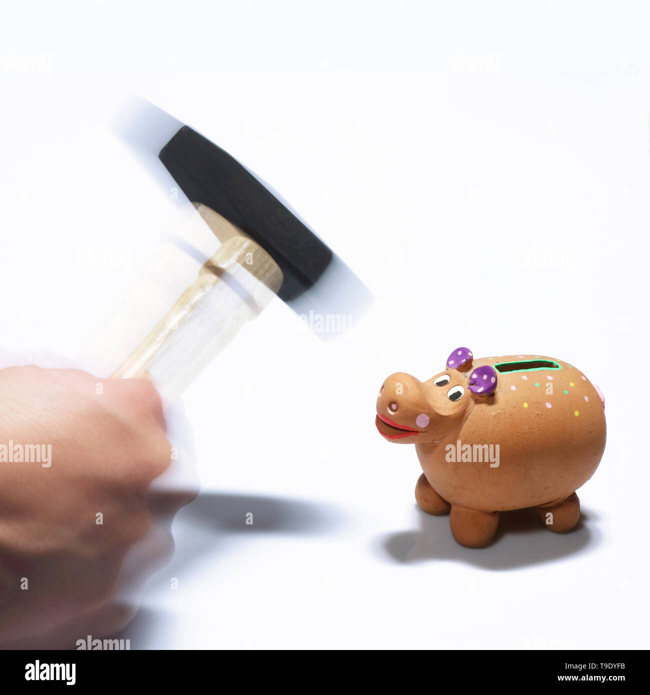 Breaking piggy bank - Breaking moneybox Stock Photo - Alamy