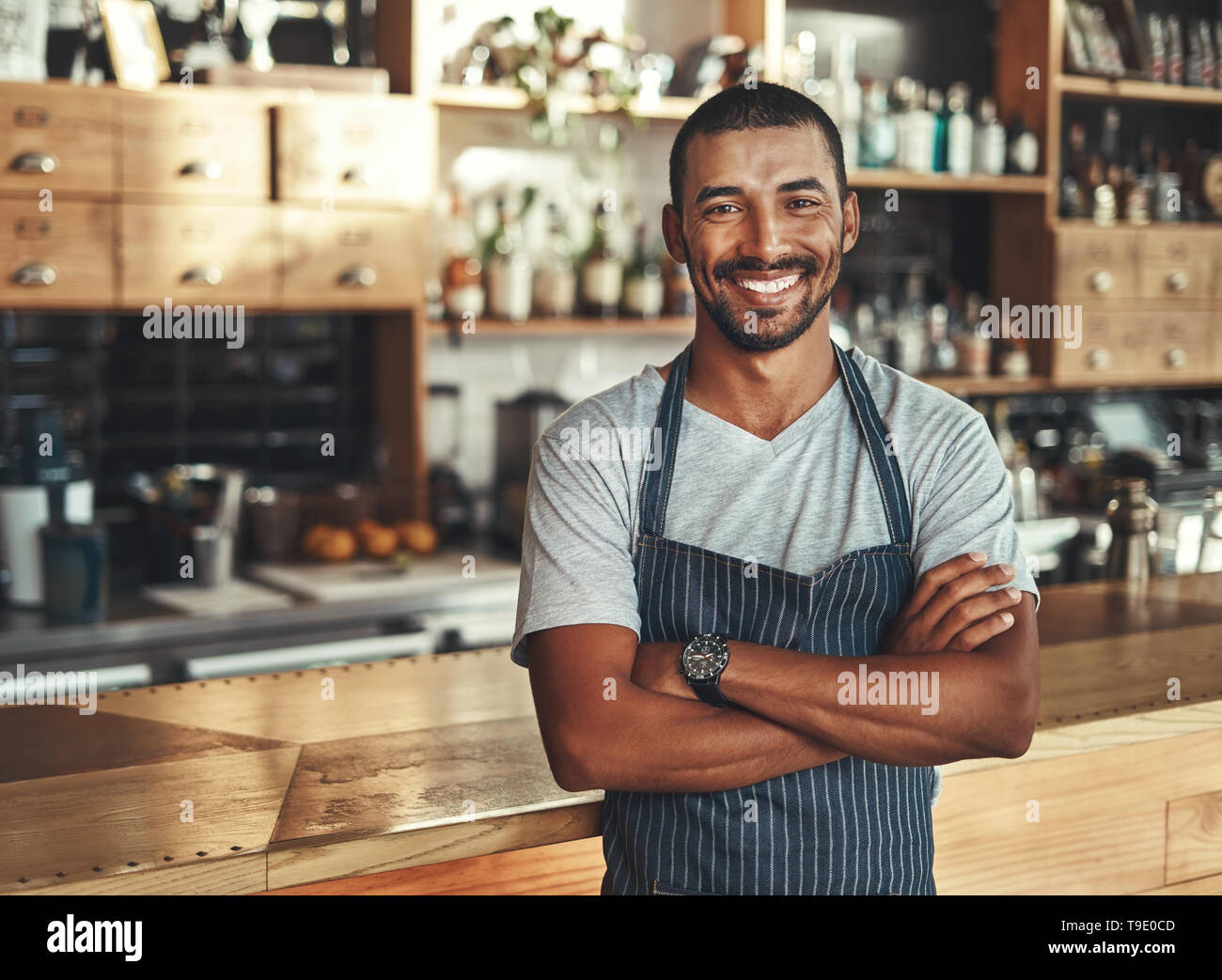 Friendly confident male owner at his cafe Stock Photo - Alamy