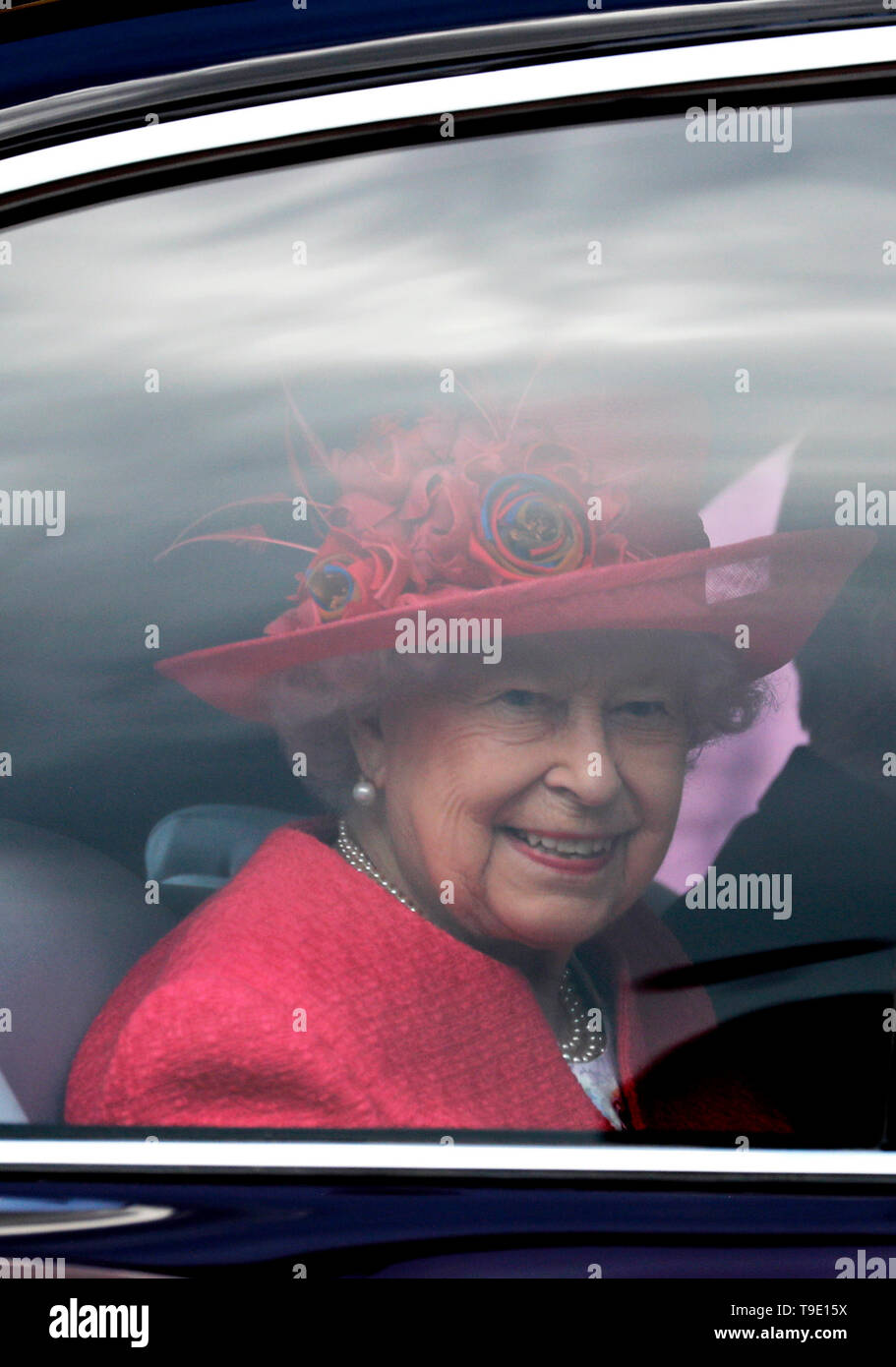 Queen Elizabeth II looks out from her car window as she leaves the ...