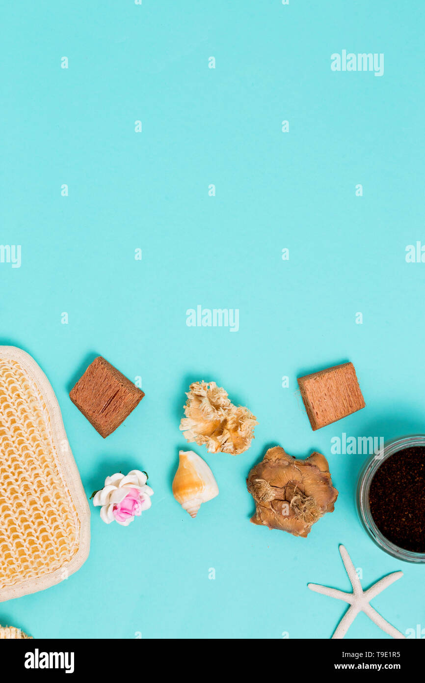 Beautiful flat lay blue background for text with Spa products. Shells ...