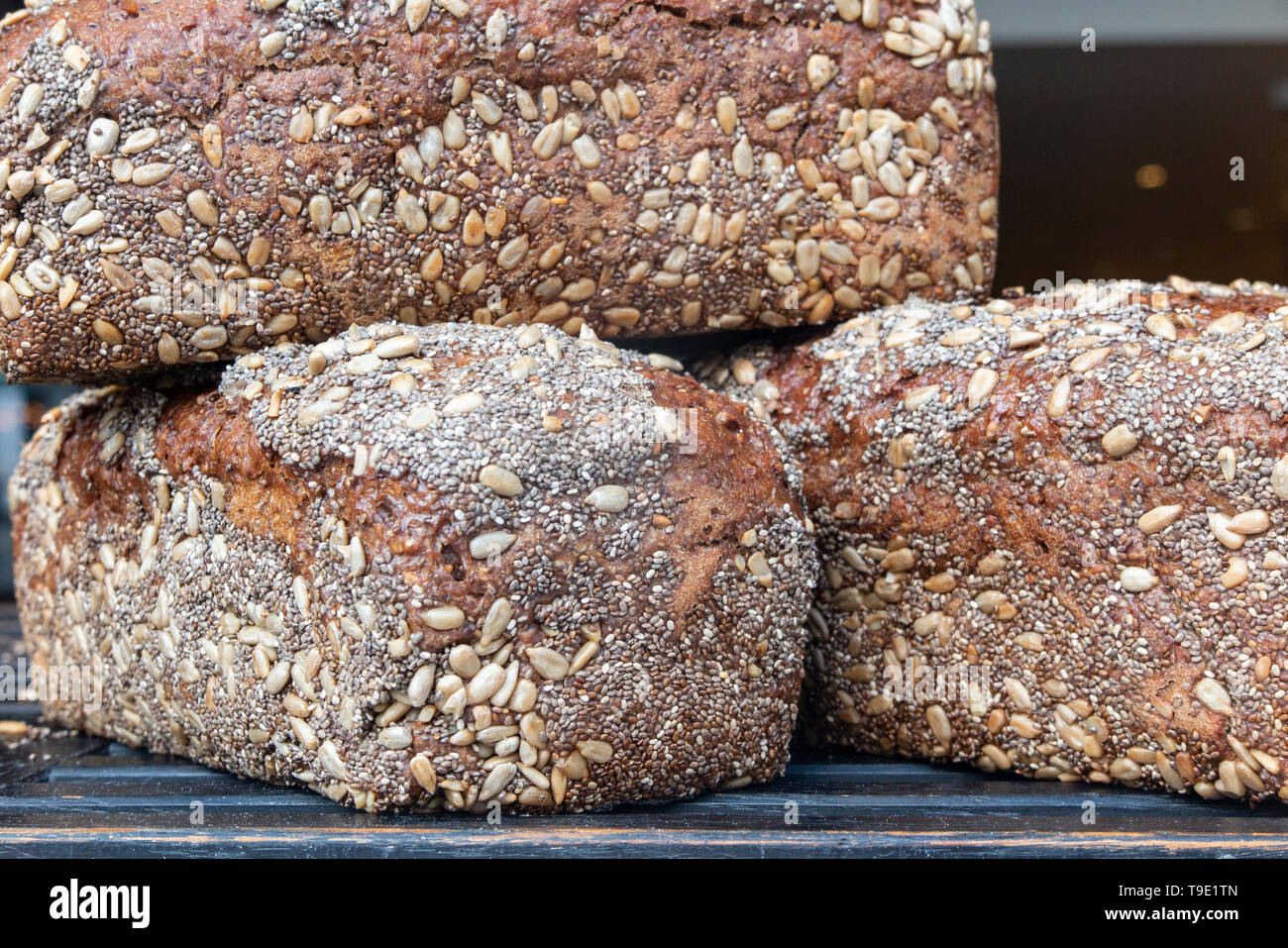 Loaves of brown bread stacked up and ready for breakfast Stock Photo ...