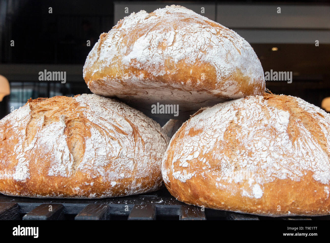 Loaves of white bread stacked up and ready for breakfast Stock Photo ...