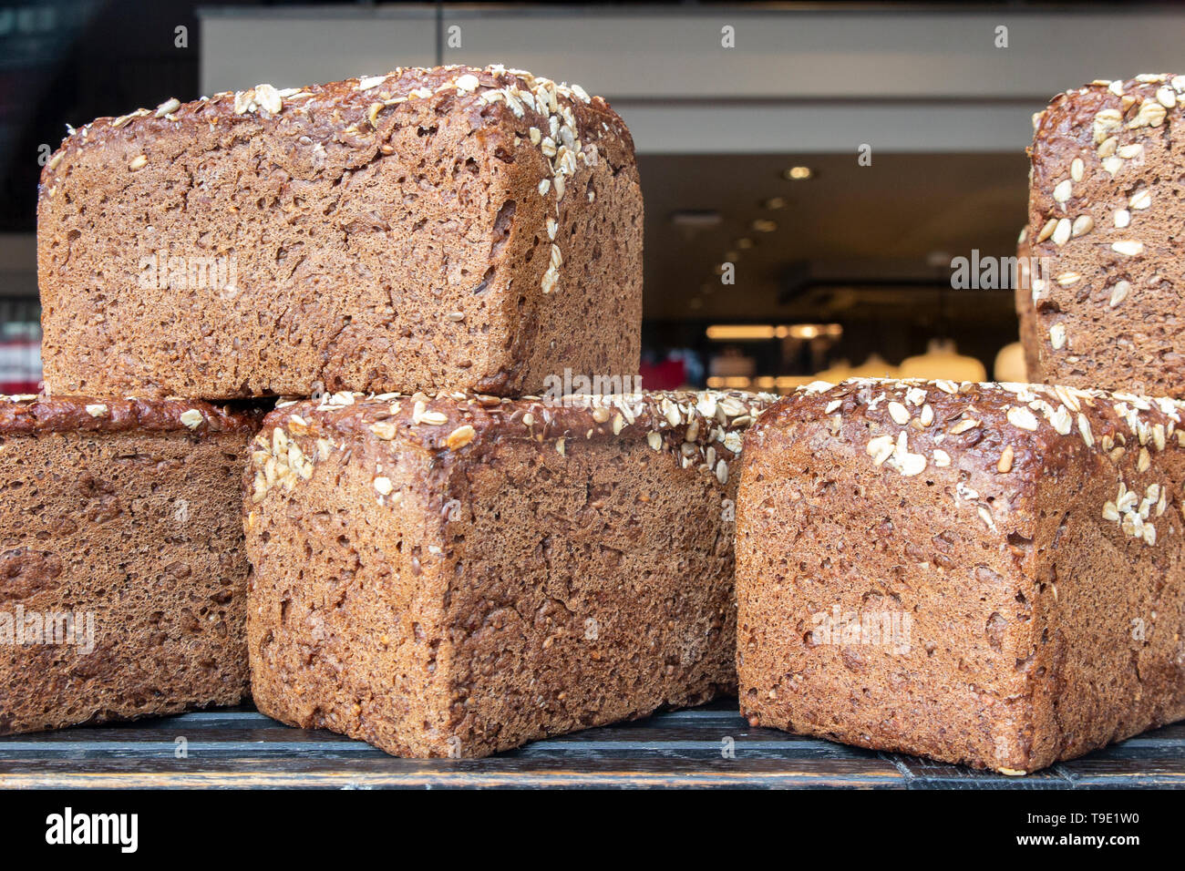 Loaves of brown bread stacked up and ready for breakfast Stock Photo ...