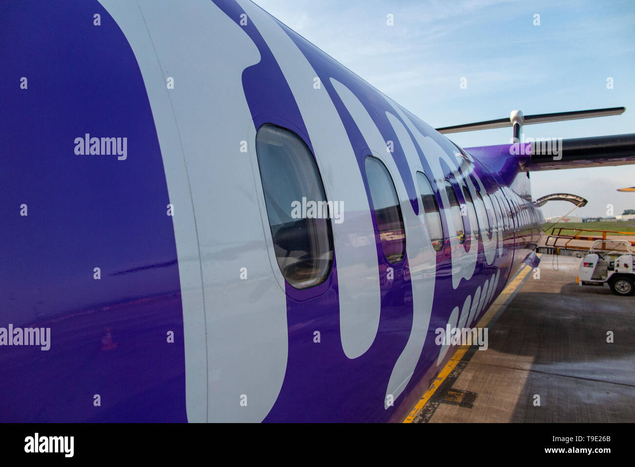A Flybe twin Prop Dash 8 Q400 plane on the runway Stock Photo - Alamy