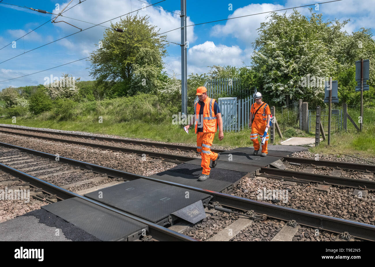 Network rail engineers with bright orange PPE clothing on the East ...