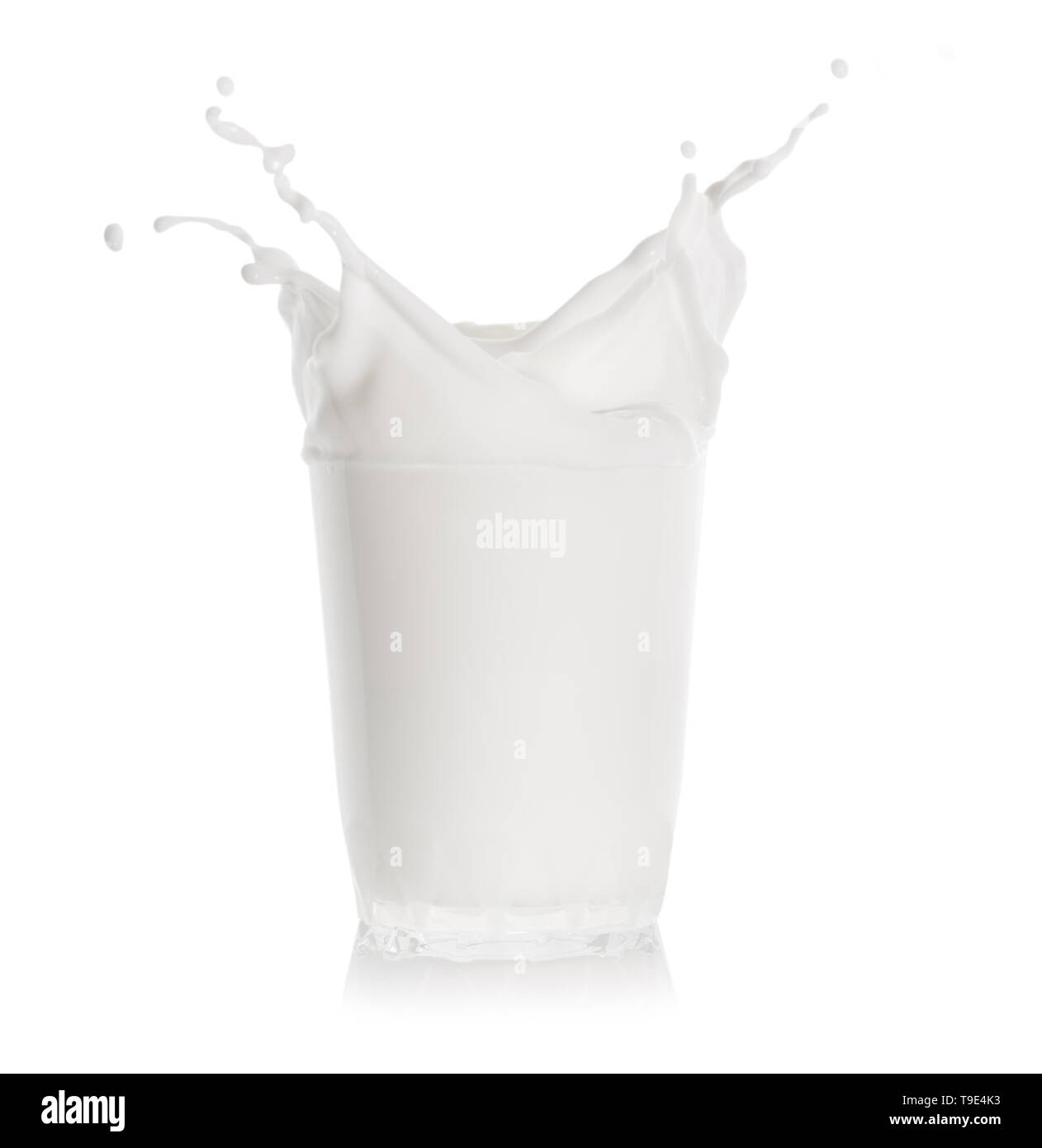 Milk splash in cup Cut Out Stock Images & Pictures - Alamy
