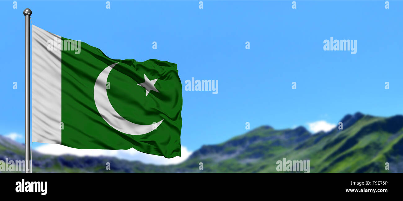 Pakistan flag waving in the blue sky with green fields at mountain peak ...